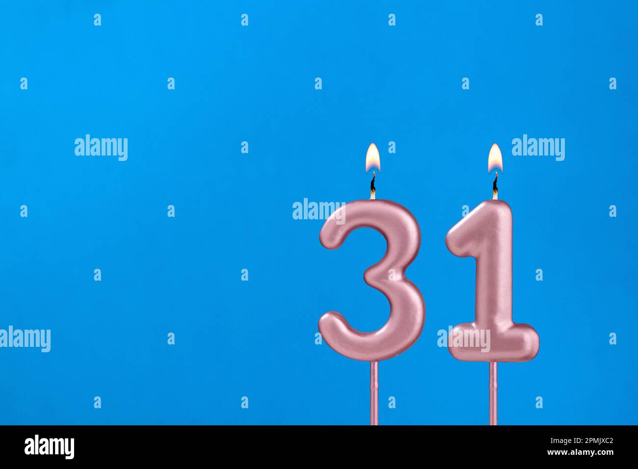 Candle number 31 - Birthday in blues foamy background Stock Photo - Alamy