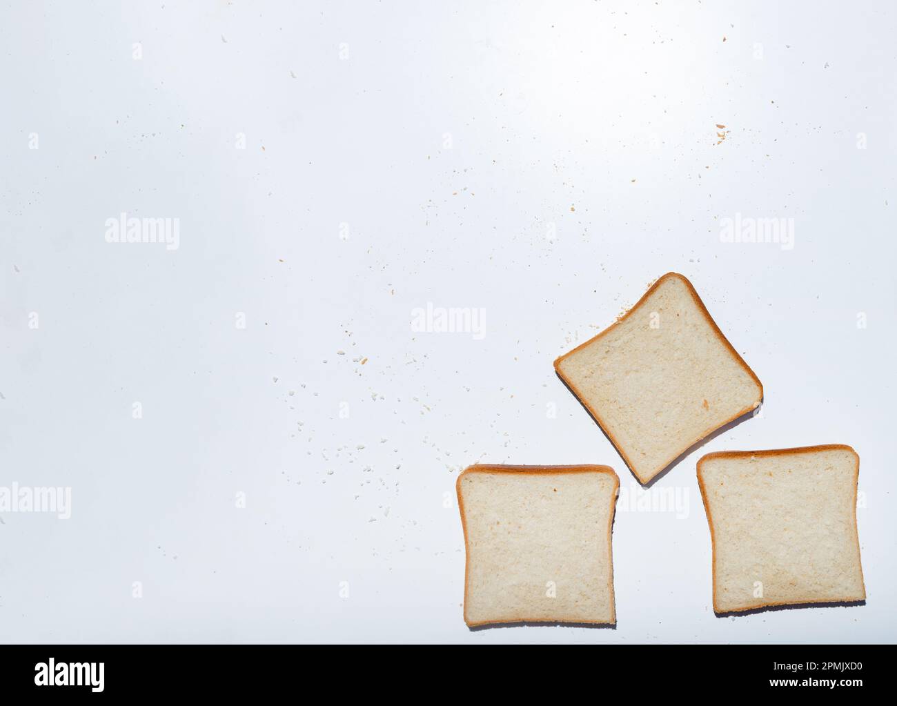 Top view of white toast bread slices with crumbs on isolated white ...