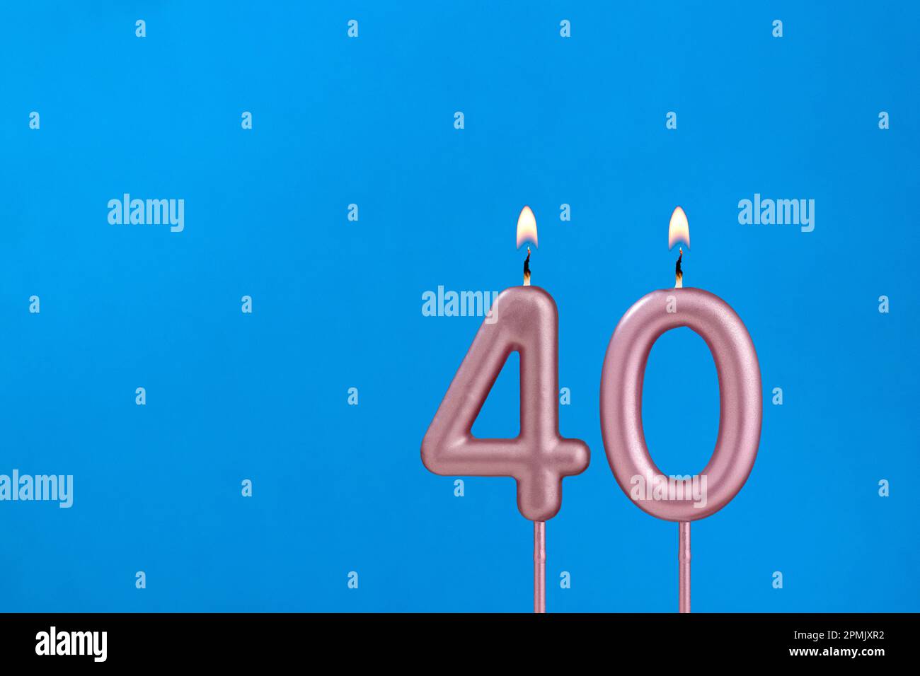 Candle number 40 - Birthday in blues foamy background Stock Photo - Alamy