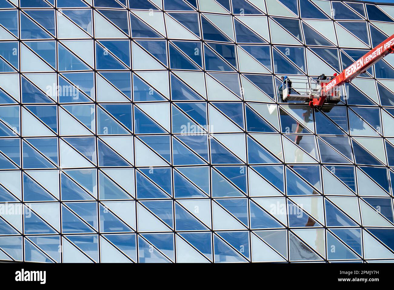 Building cleaners clean window panes, clean a facade, truck working ...