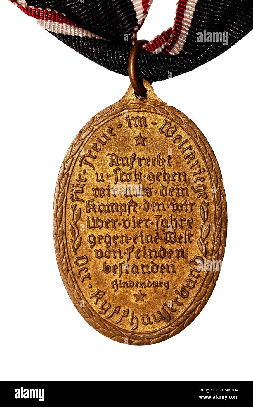 Old German military badge on ribbon isolated on white background. For ...