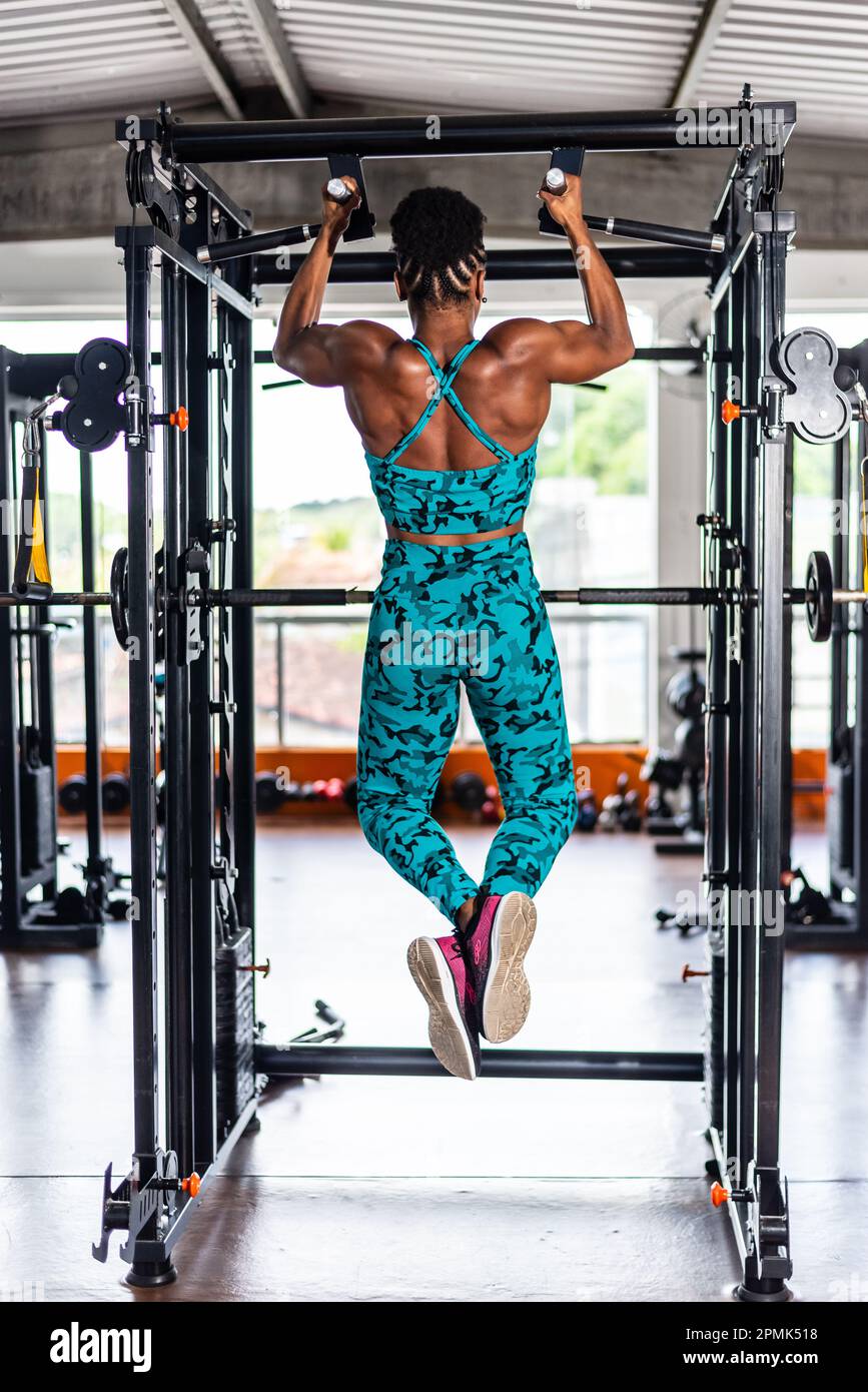 Muscular woman doing push-ups in the gym. Crossfit training Stock Photo ...