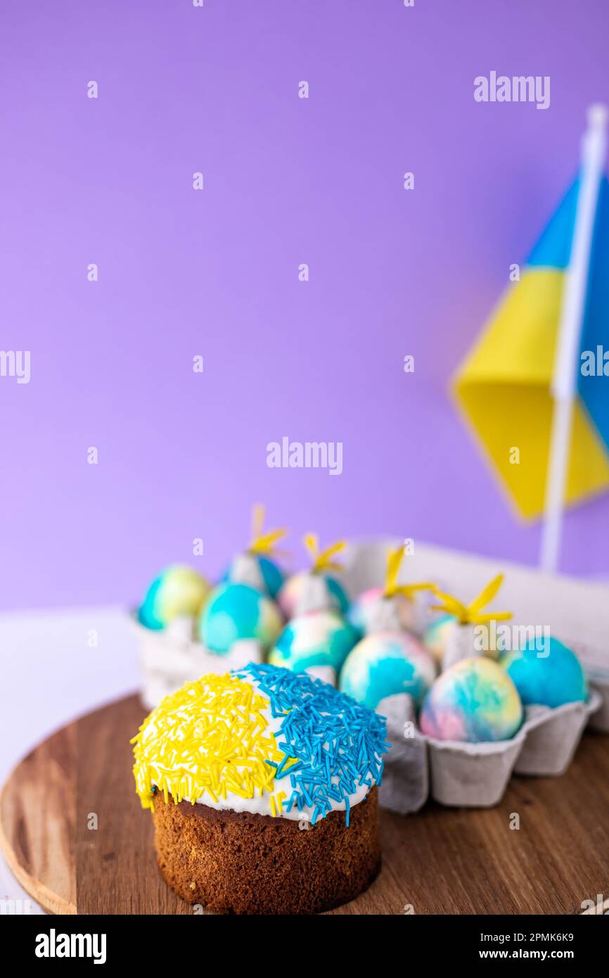 Easter cake decorated in colors of Ukrainian flag and eggs painted in ...