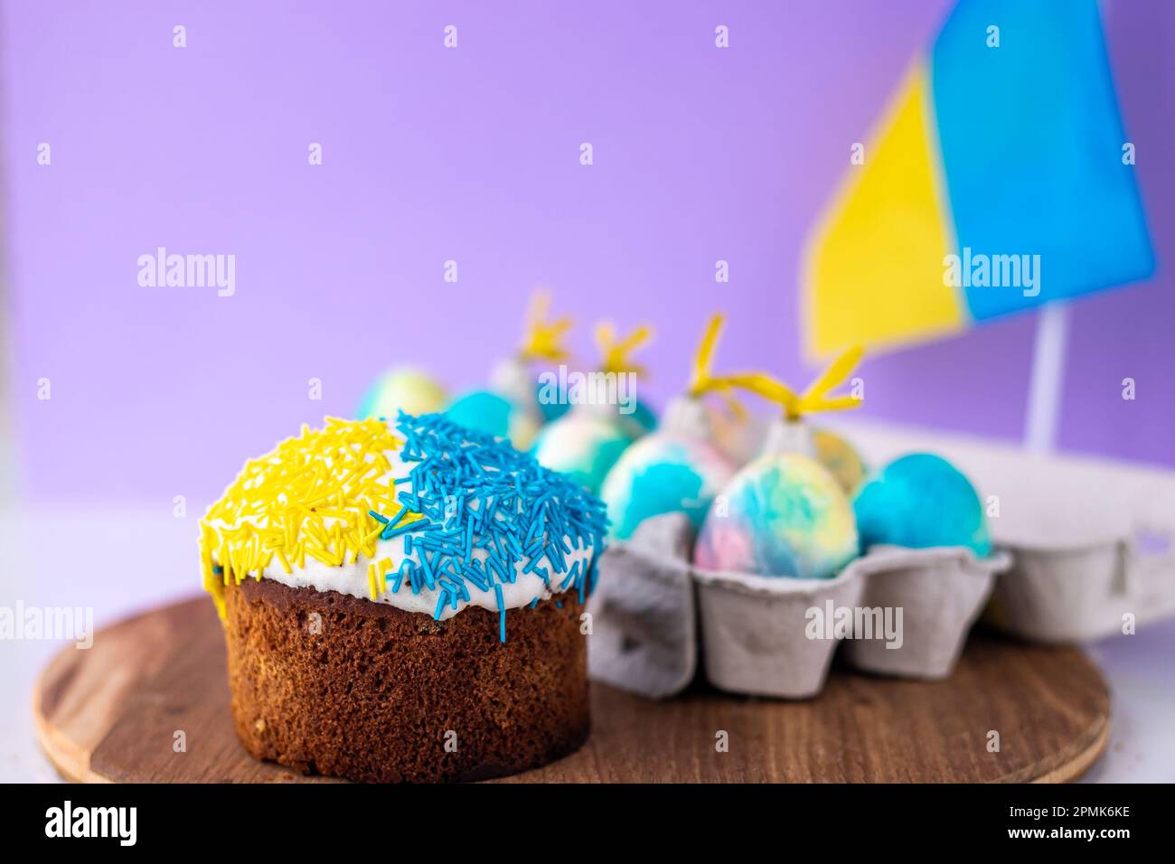Easter cake decorated in colors of Ukrainian flag and eggs painted in ...