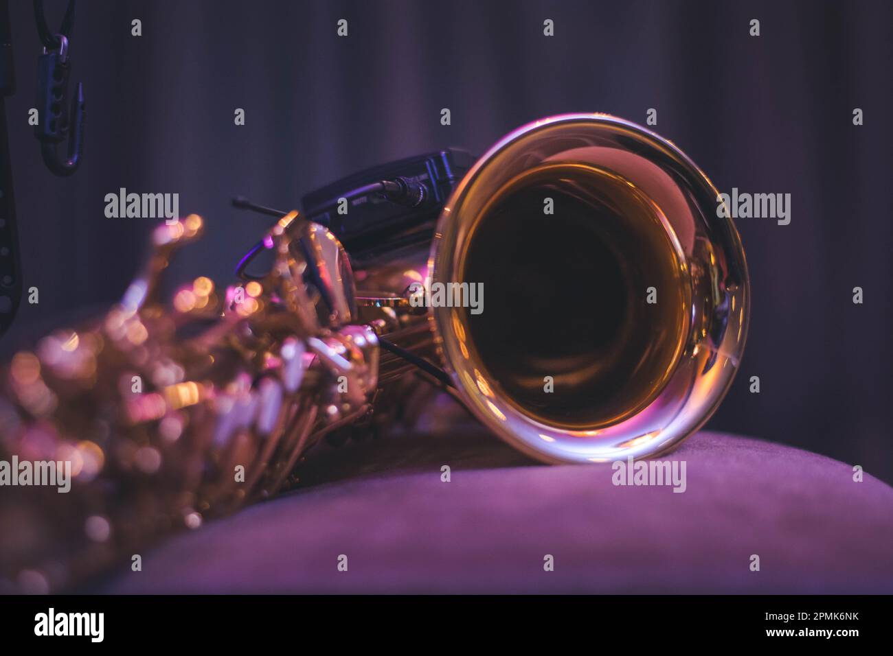 A close-up shot of a golden saxophone, displaying the instrument's keys ...
