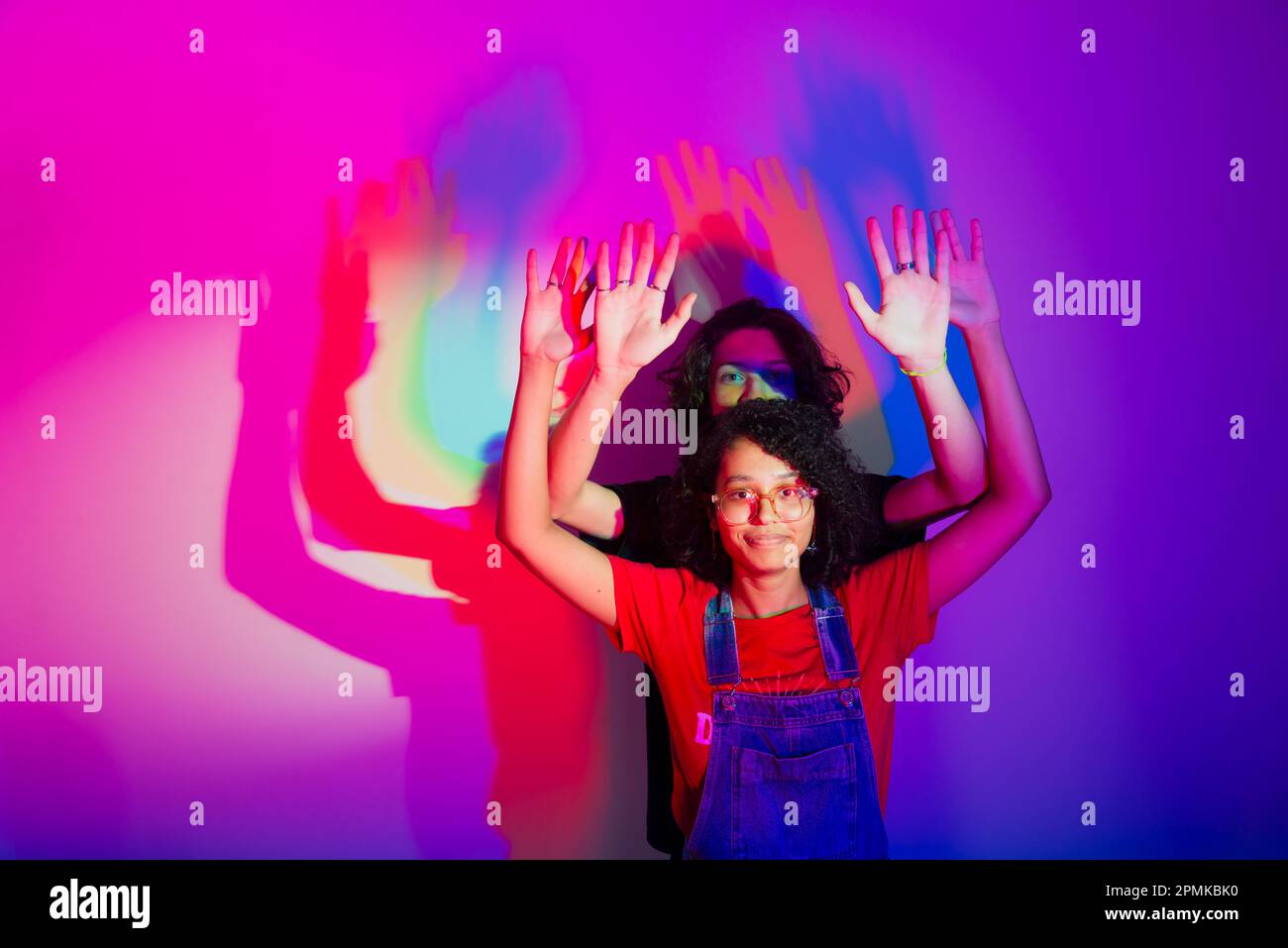 Portrait of two young lovers, isolated on background with colored ...