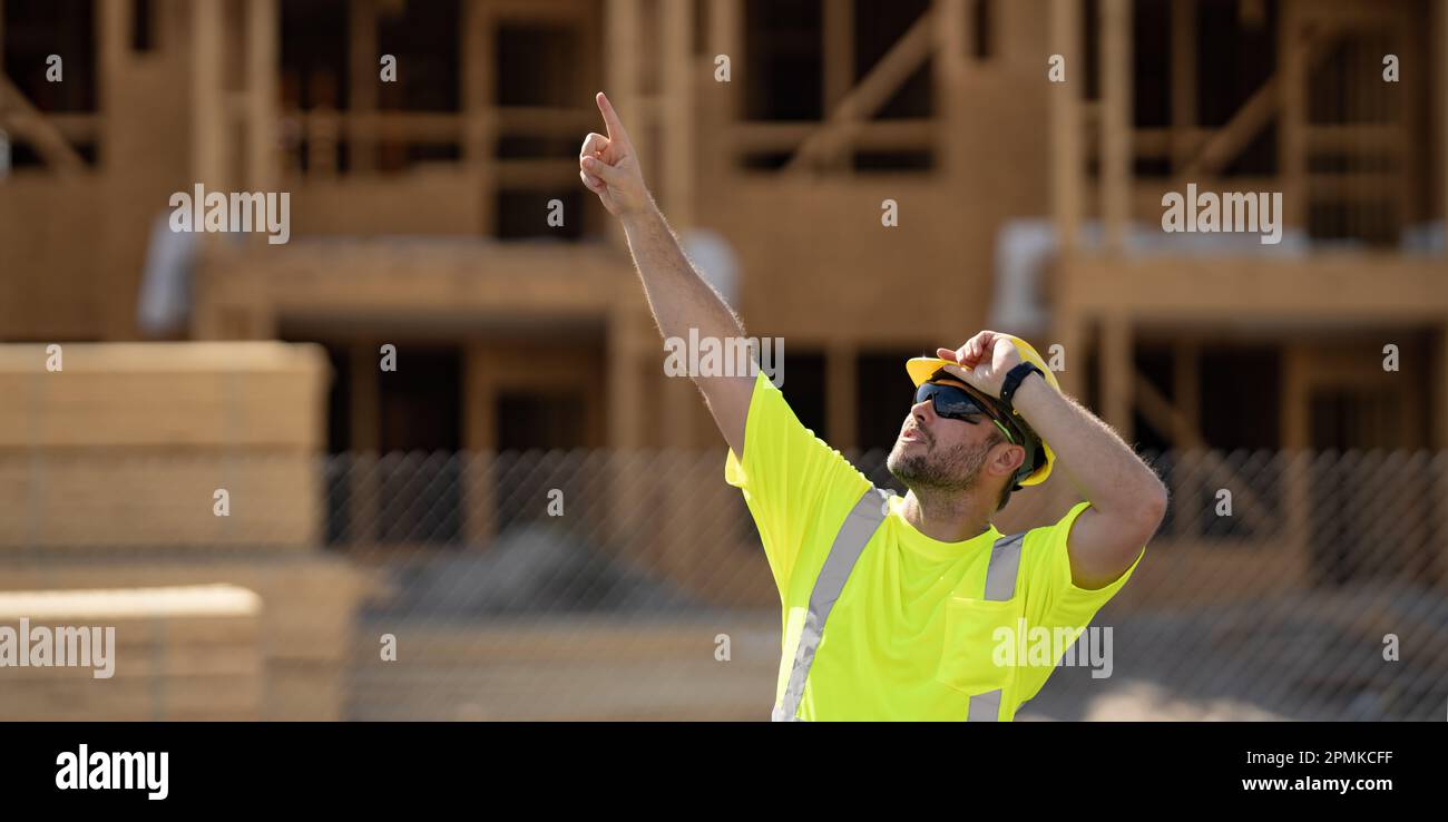 Construction builder in building uniform on buildings construction ...