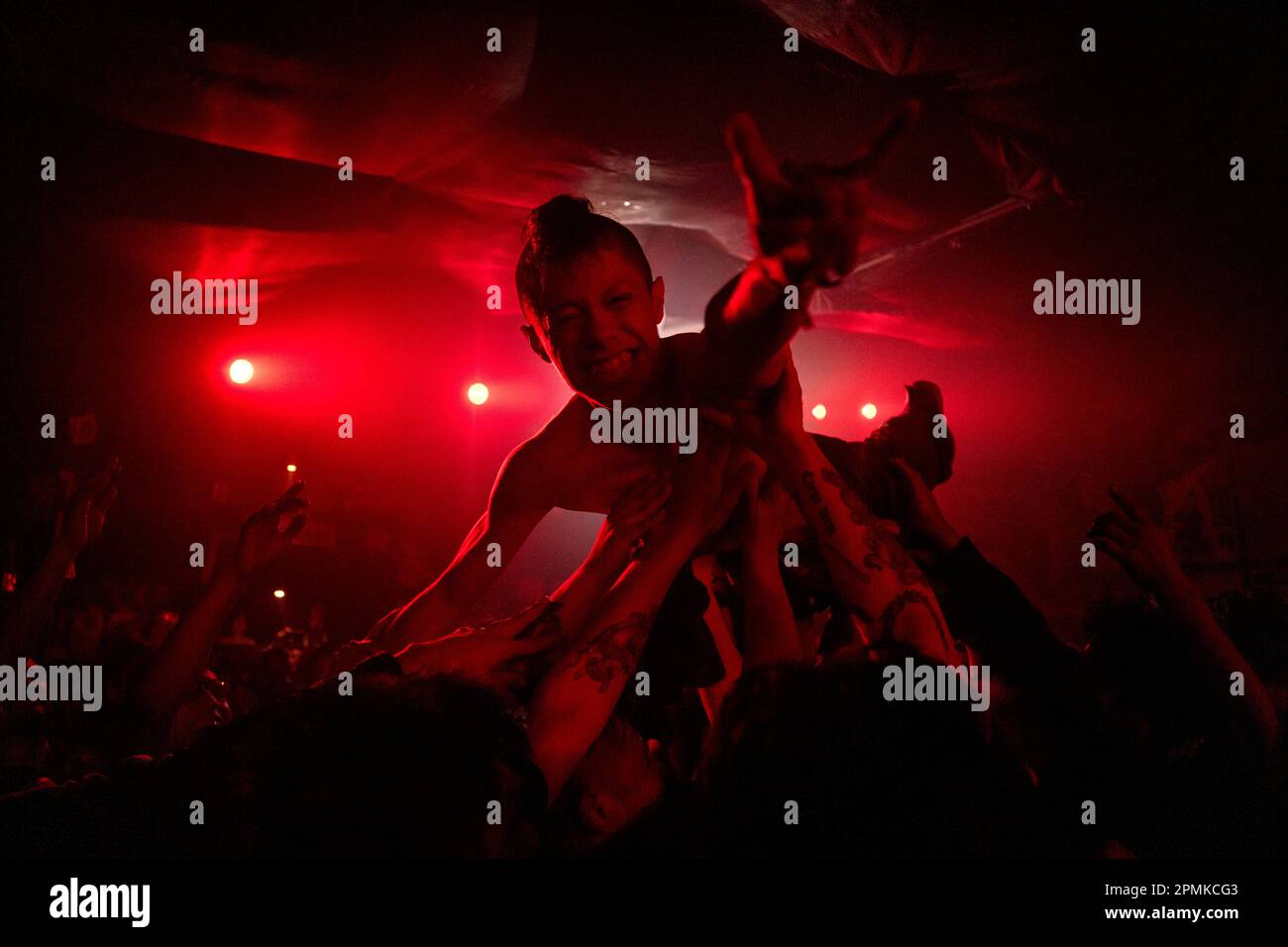 Fans of the Mexican Punk Rock band Seguimos Perdiendo dance during one ...