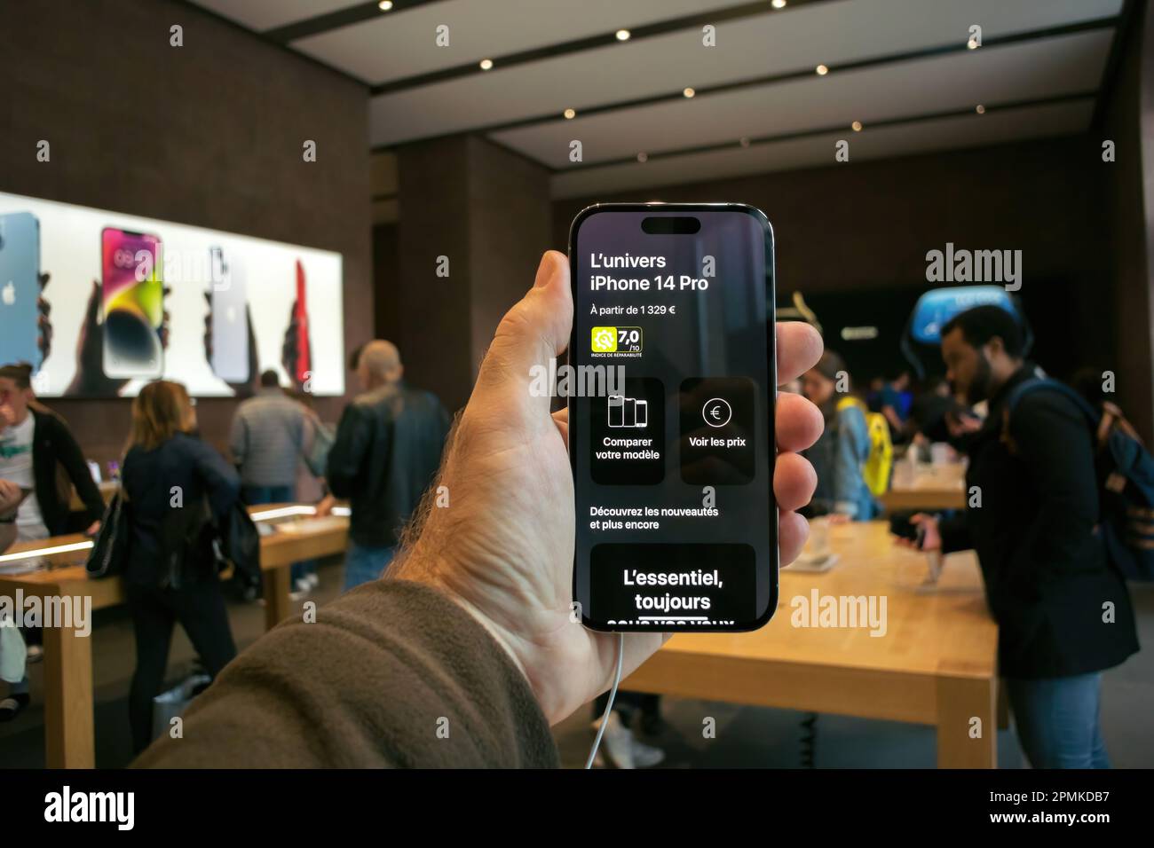 Paris, France - Sep 22, 2022: Hand holding Apple iPhone 14 Pro Max with ...