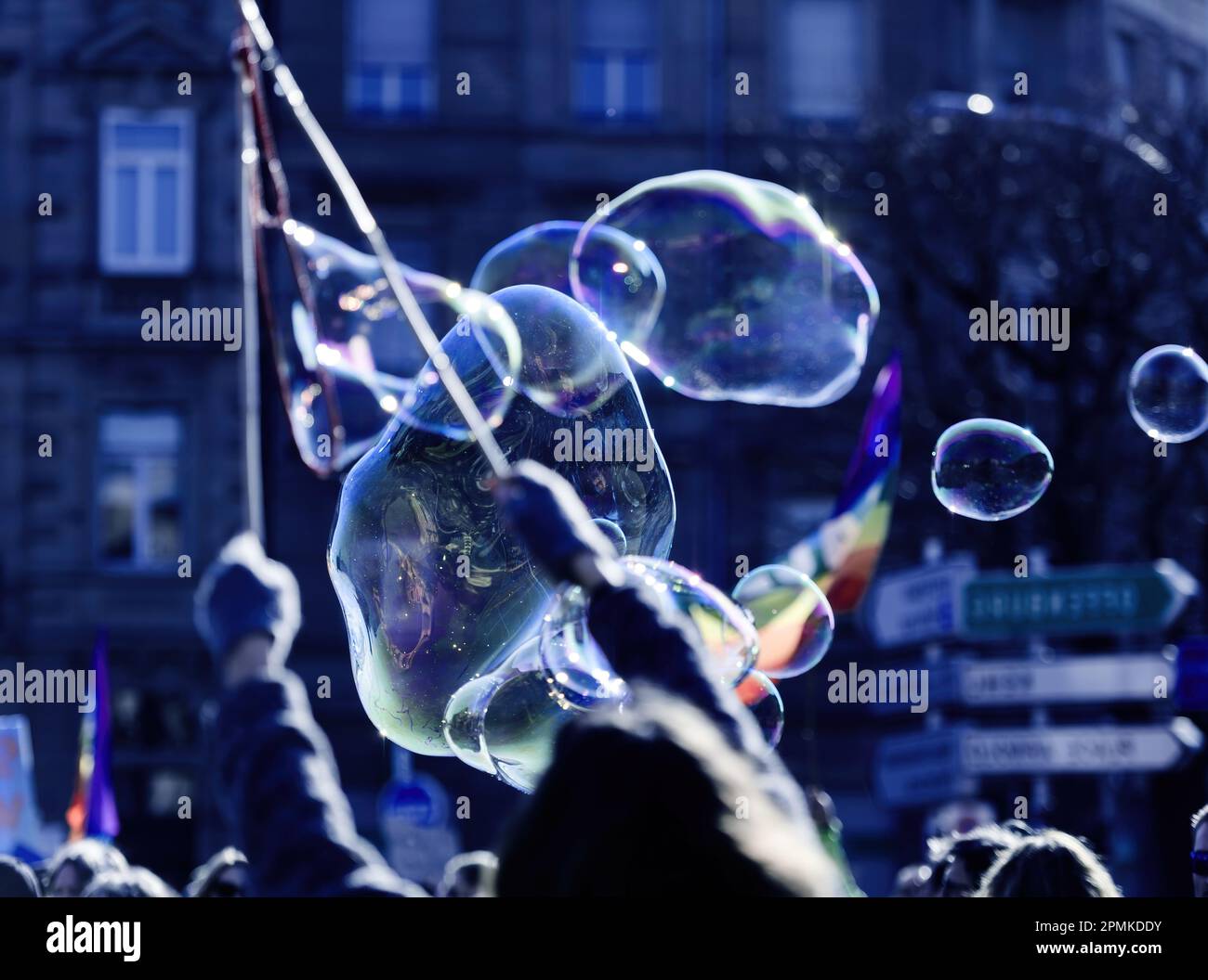 A group of people raising their hands to the sky, creating huge liquid ...