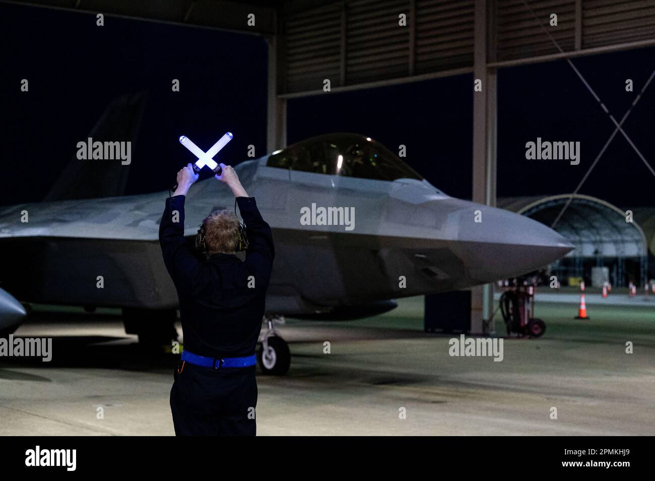 A crew chief assigned to the 94th Fighter Squadron communicates to a F ...