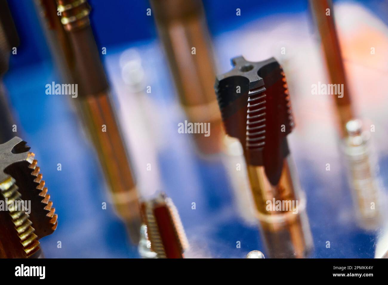 Various size roll forming taps exposed in hardware store Stock Photo ...