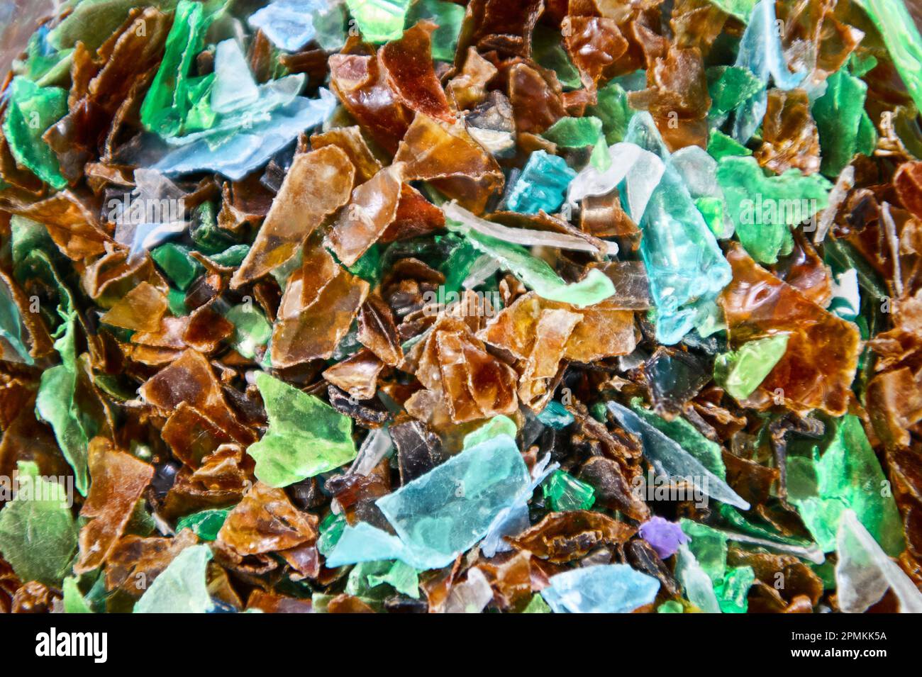 Chopped pieces of plastic made of recycled waste plastic in open sack ...