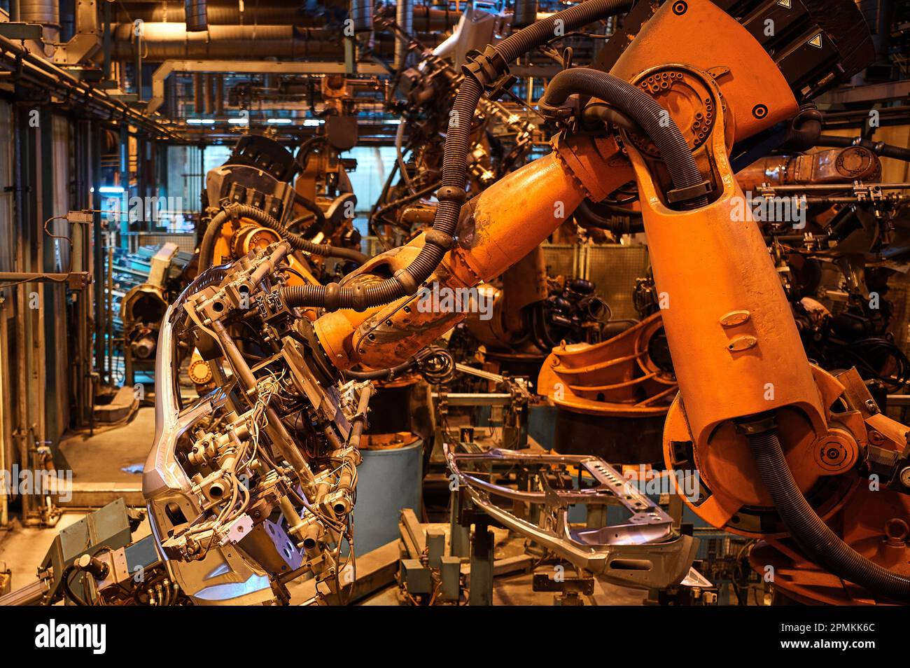 Robotic welder machine tools process metal details in shop Stock Photo ...