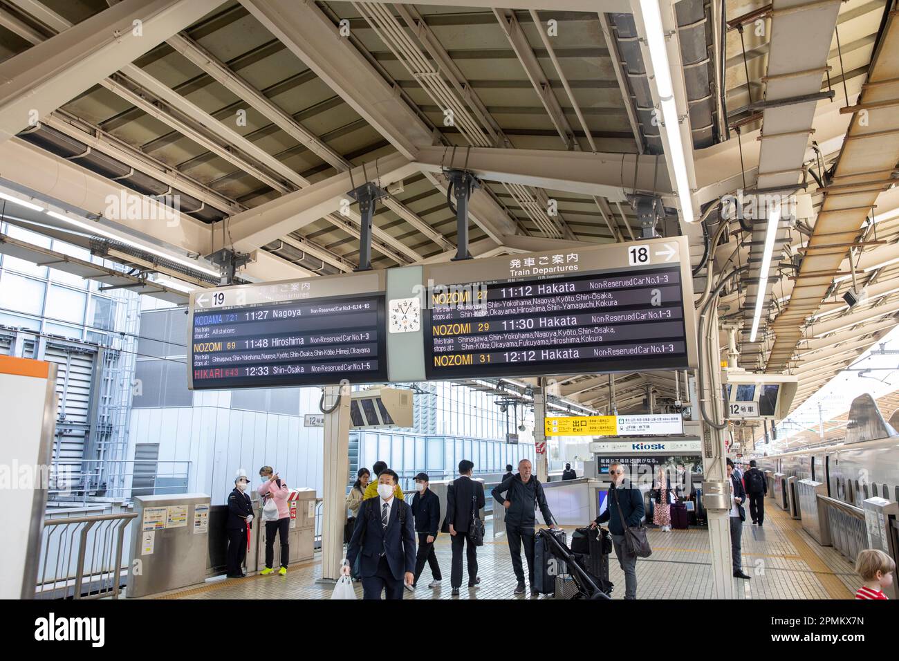 Shinkansen bullet train platforms April 2023, passengers wait to board high speed bullet train ...
