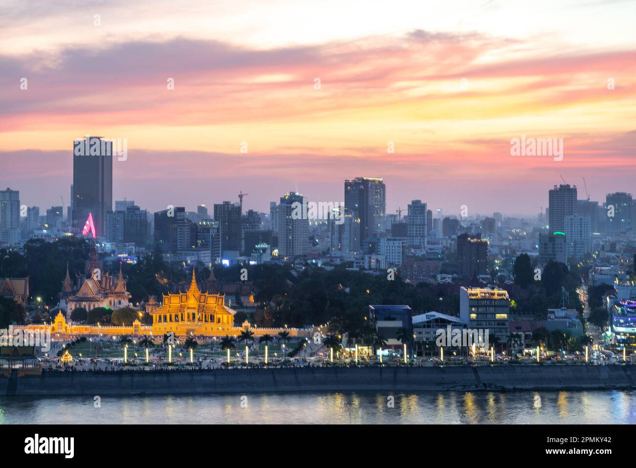 The golden afterglow over Cambodia's capital city,it's busy Riverside ...