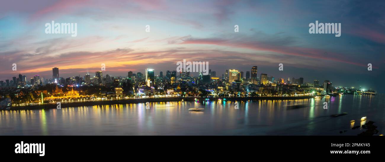 The golden afterglow over Cambodia's capital city,it's busy Riverside ...