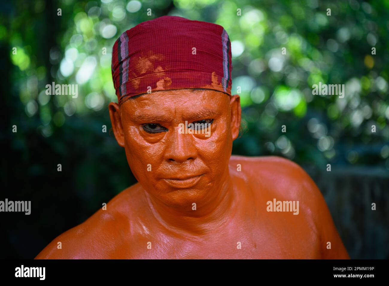 Portrait of a Hindu community devotee as he takes part in a festival ...