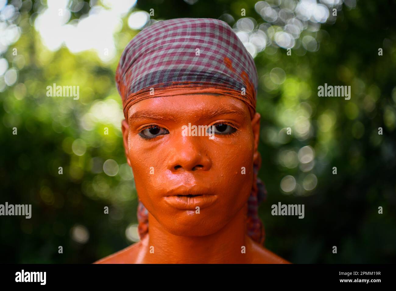 Portrait of a Hindu community devotee as he takes part in a festival ...