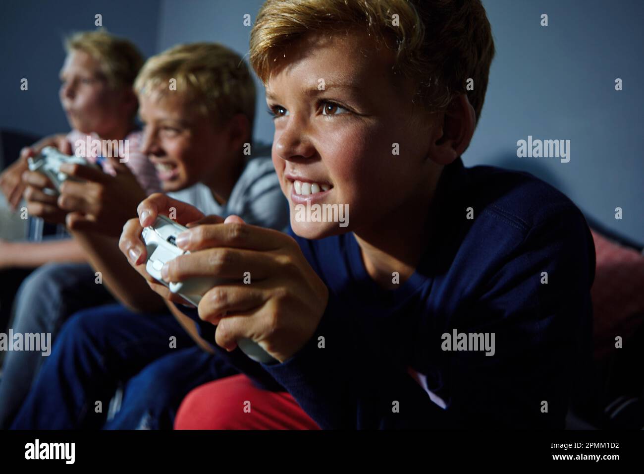 Just a bit of friendly competition. young boys playing video games ...