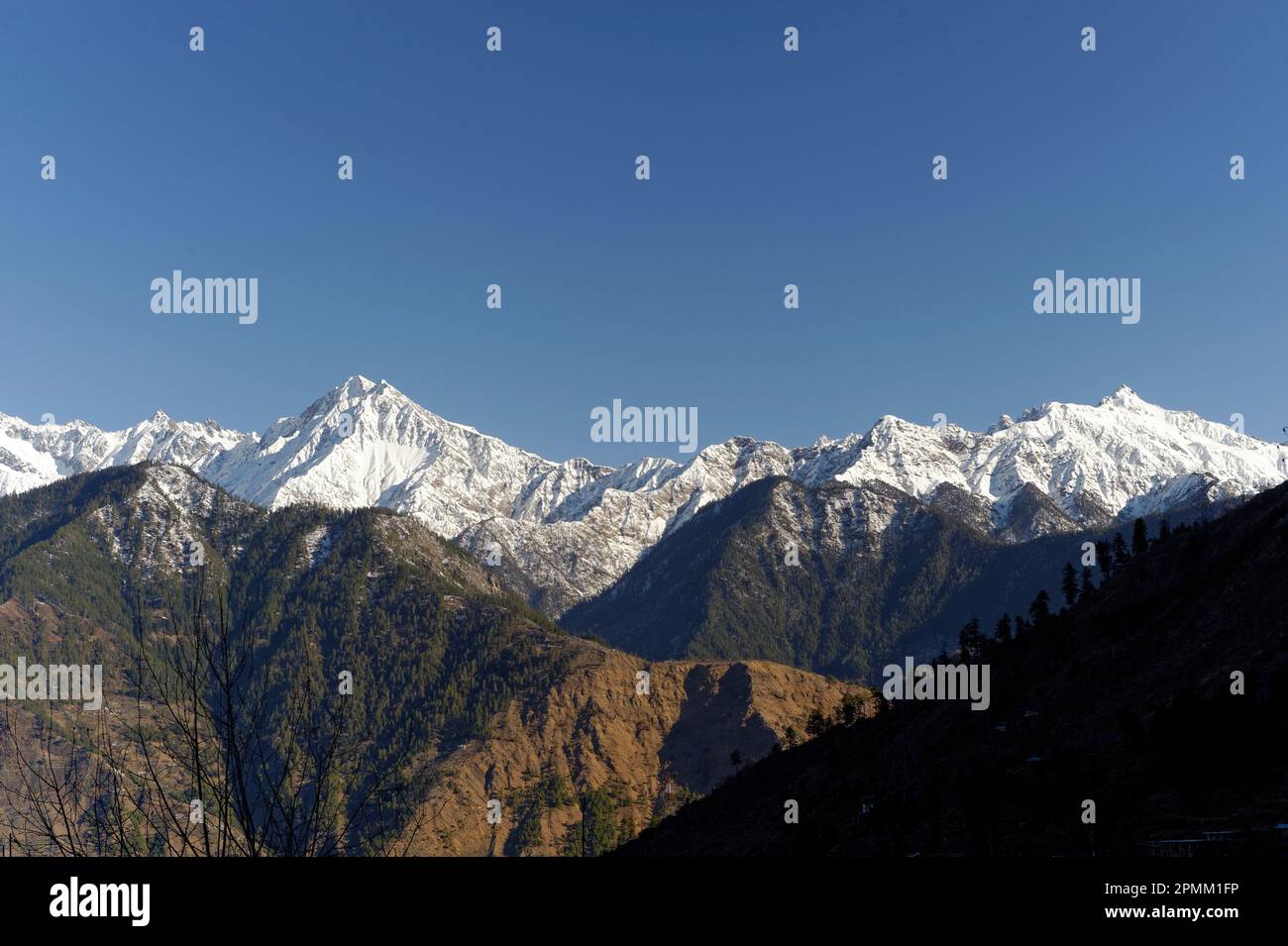 View of a snow capped Himalayan mountains in morning time near Sarahan ...