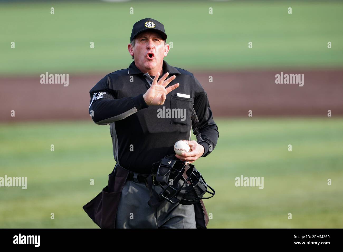 Home plate umpire Rusty Griffin announces a player substitution during ...