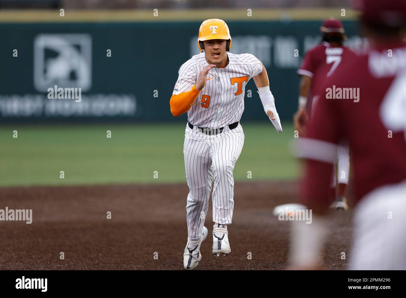 Tennessee Volunteers first baseman Hunter Ensley (9) hustles to third ...