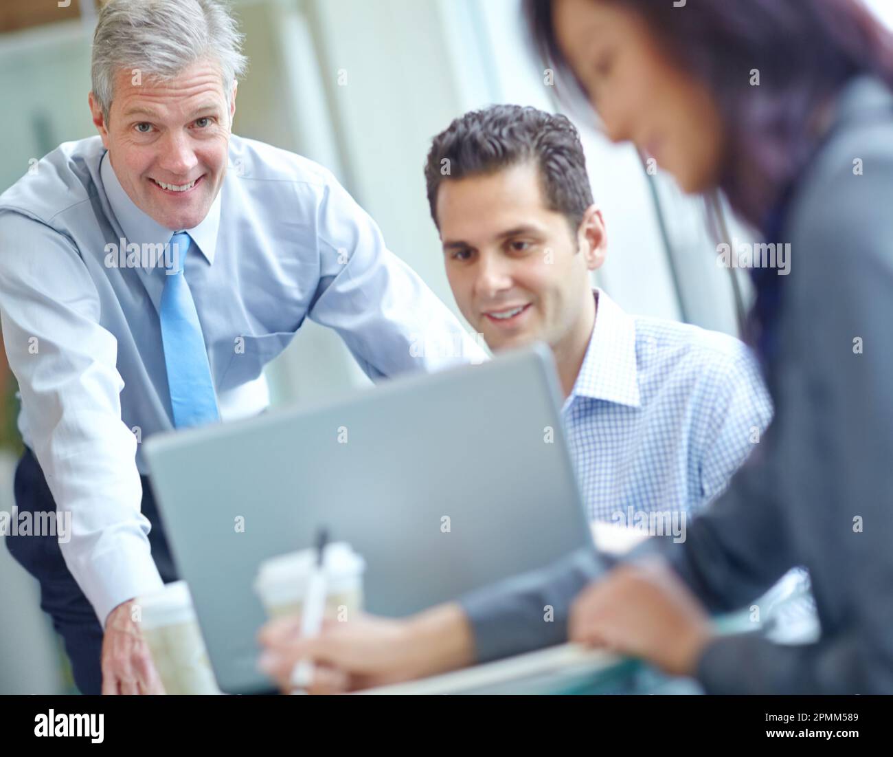 Refining our business strategy. A group of three businesspeople having ...