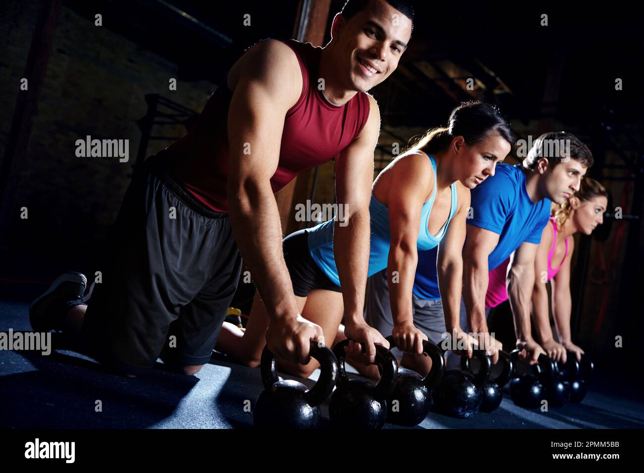 Team of bodybuilders. a group of young men and women attending an ...