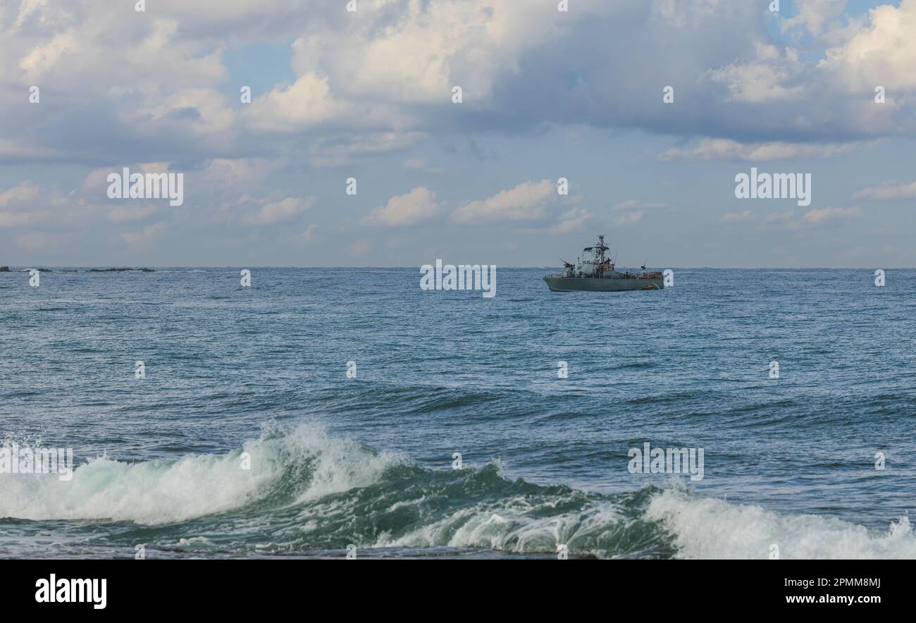 military ship on the background of waves and clouds Stock Photo - Alamy