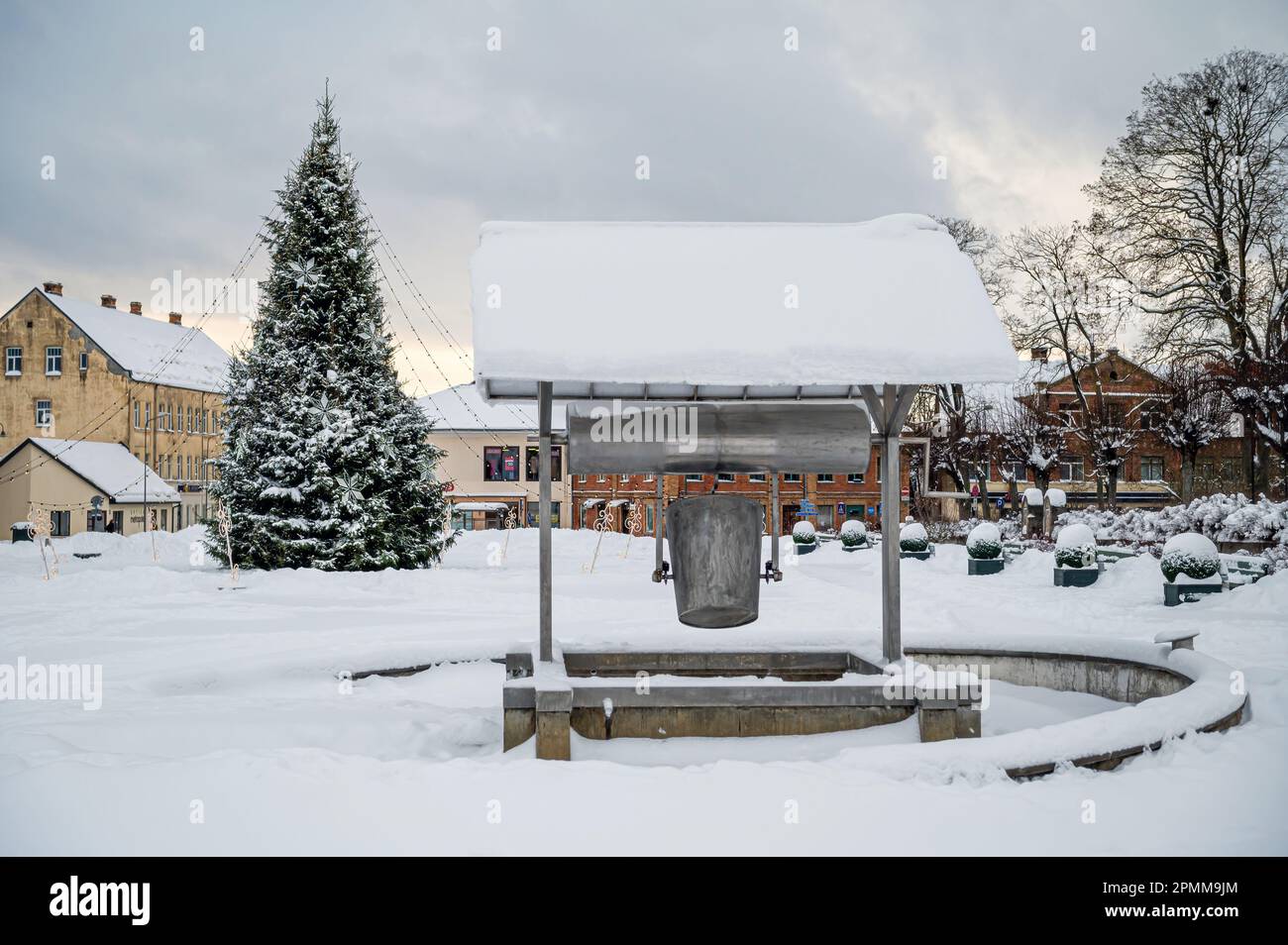 Dobele, Latvia - December 13, 2022: A snow-covered fountain and a ...