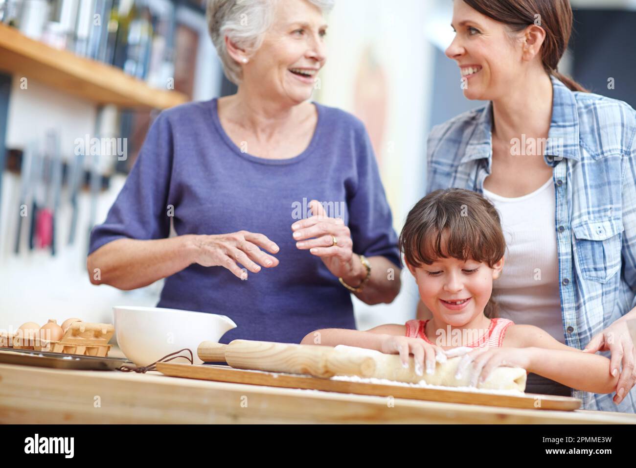 The women of the family love baking. a three generational family baking ...