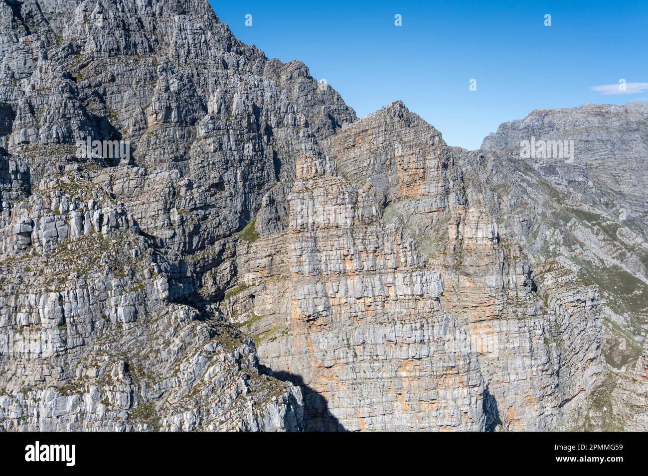 aerial landscape, from a glider, with colorful overhanging rocky slopes ...