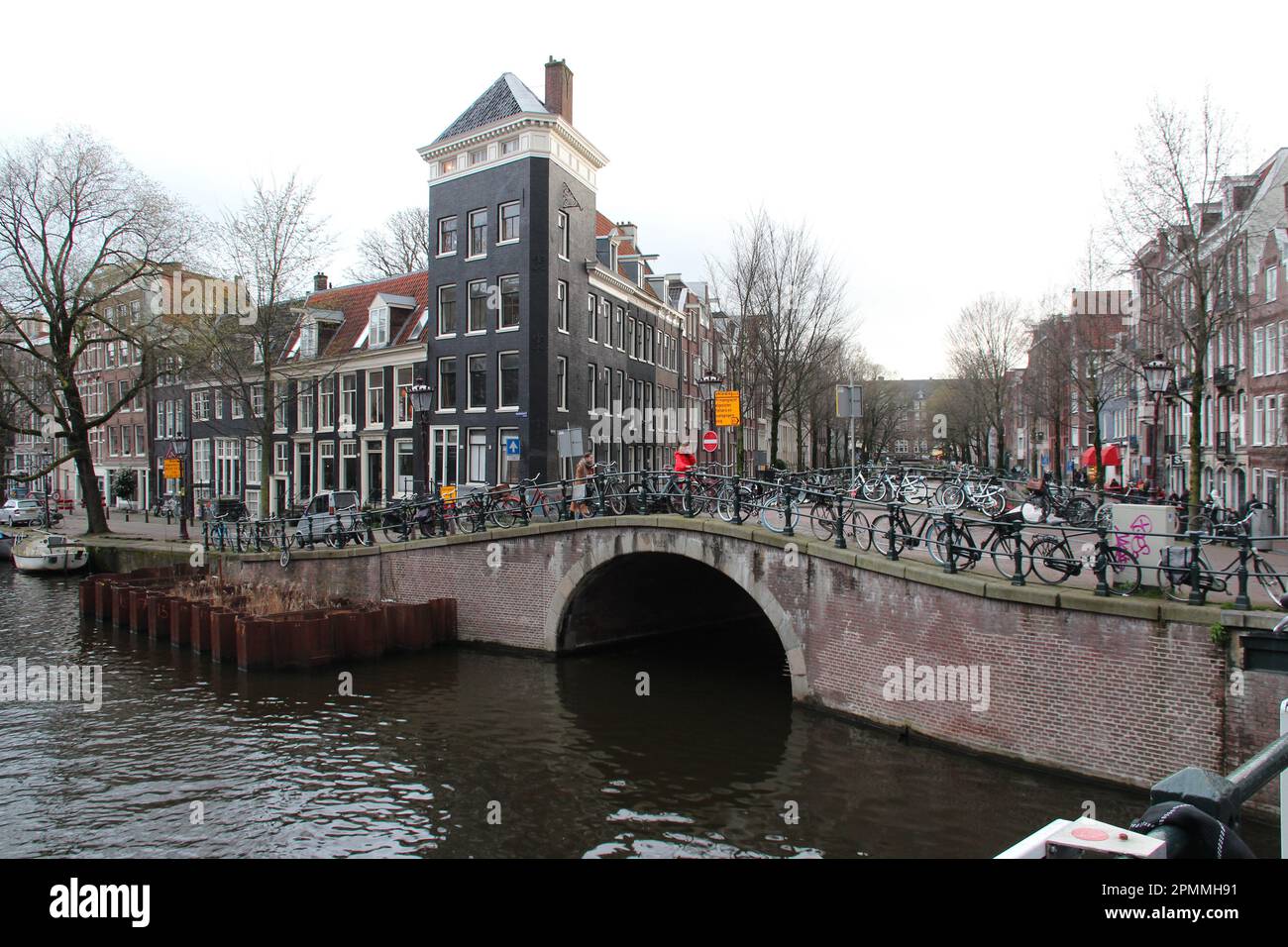 canal, river and old brick houses or flat buildings in amsterdam (the ...