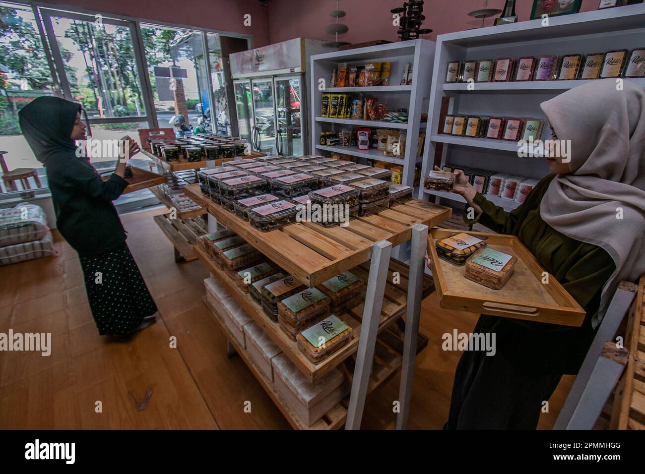 Workers produce pastries at the Rafita's Cake outlet, Bogor City ...