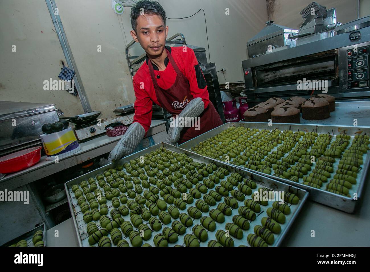 Workers produce pastries at the Rafita's Cake outlet, Bogor City ...