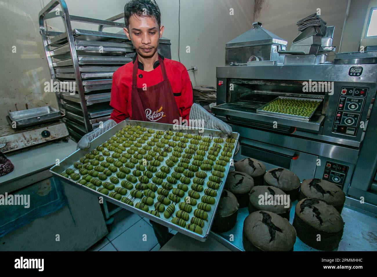 Workers produce pastries at the Rafita's Cake outlet, Bogor City ...