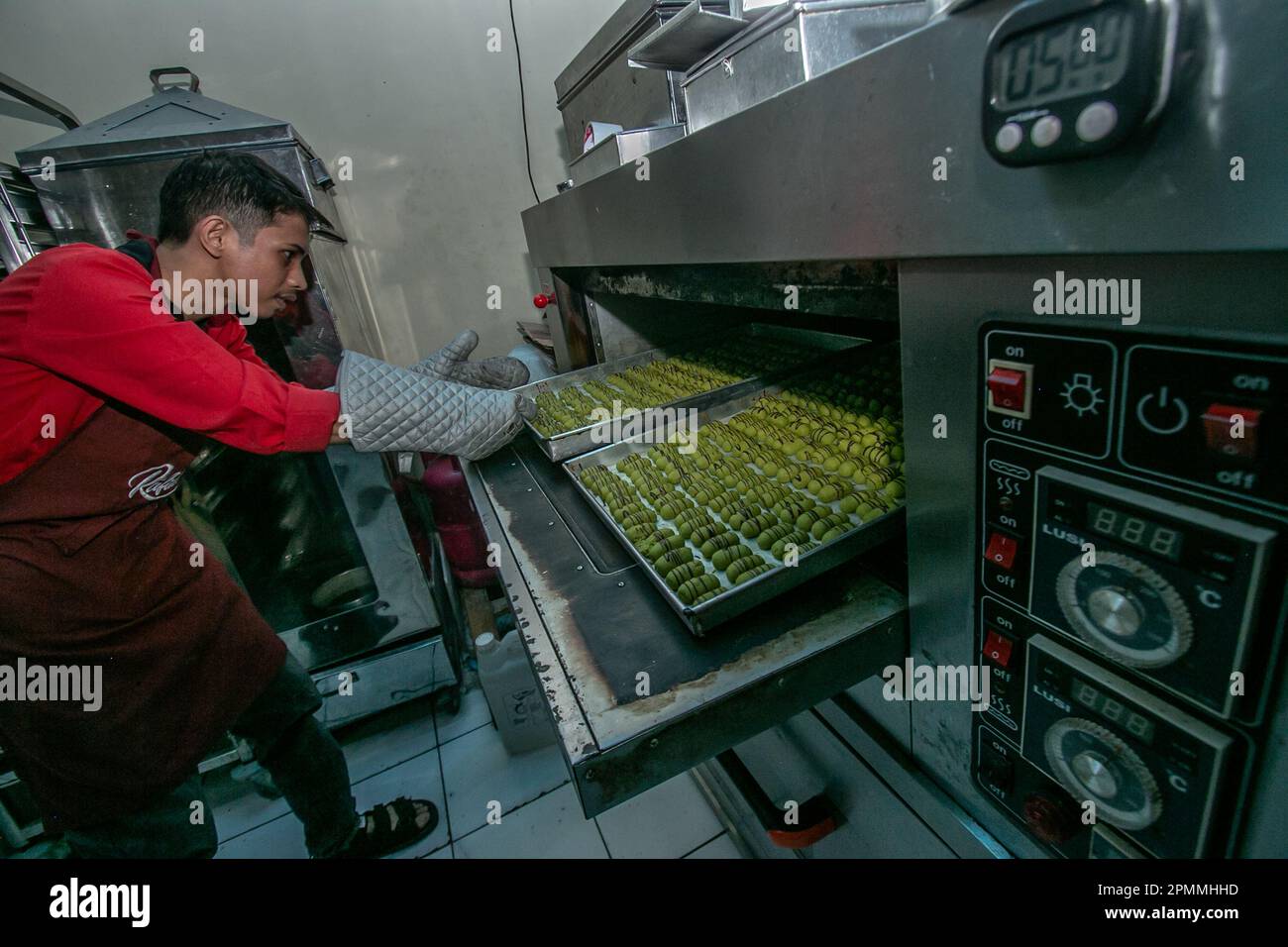 Workers produce pastries at the Rafita's Cake outlet, Bogor City ...