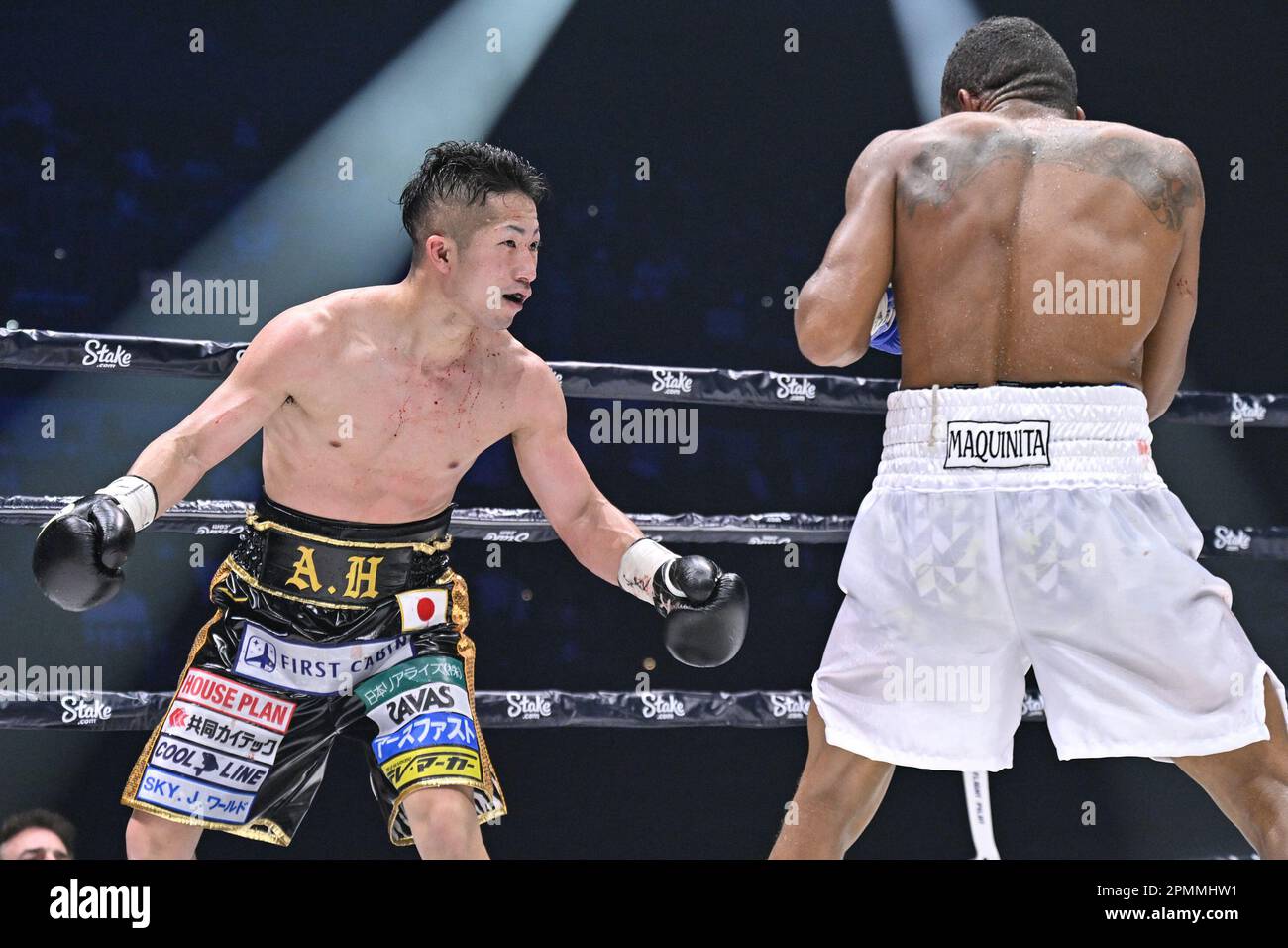 Takuma Inoue (black gloves) of Japan and Liborio Solis (blue gloves) of ...