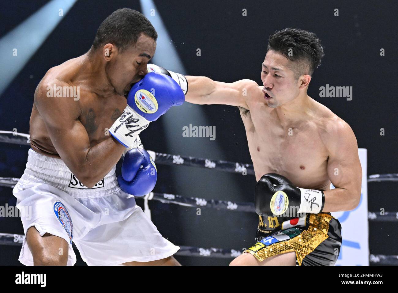Takuma Inoue (black gloves) of Japan and Liborio Solis (blue gloves) of ...