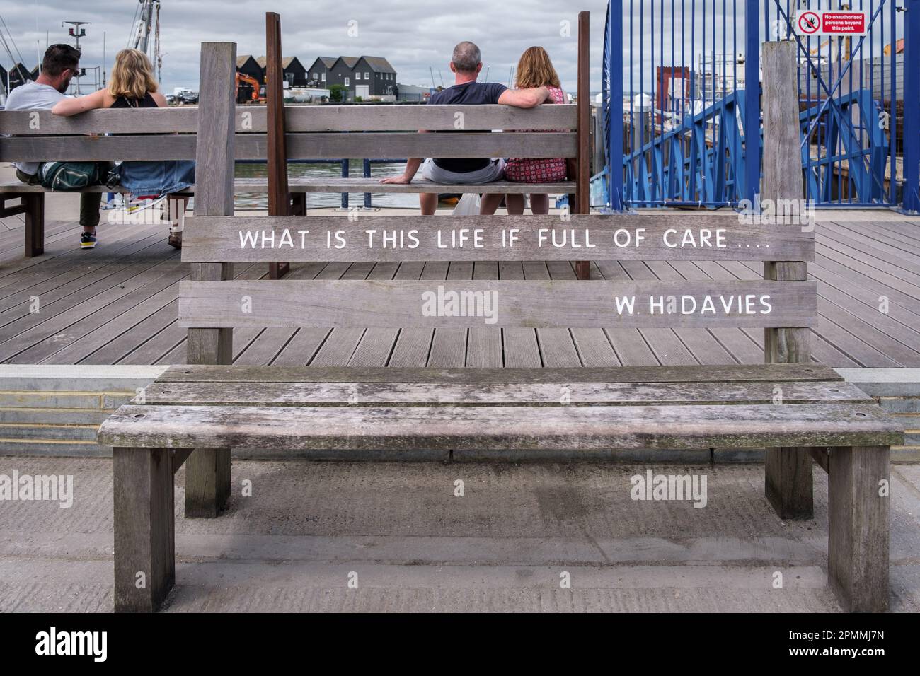 Wooden bench with inspirational quote by W.H. Davies at Whitstable ...