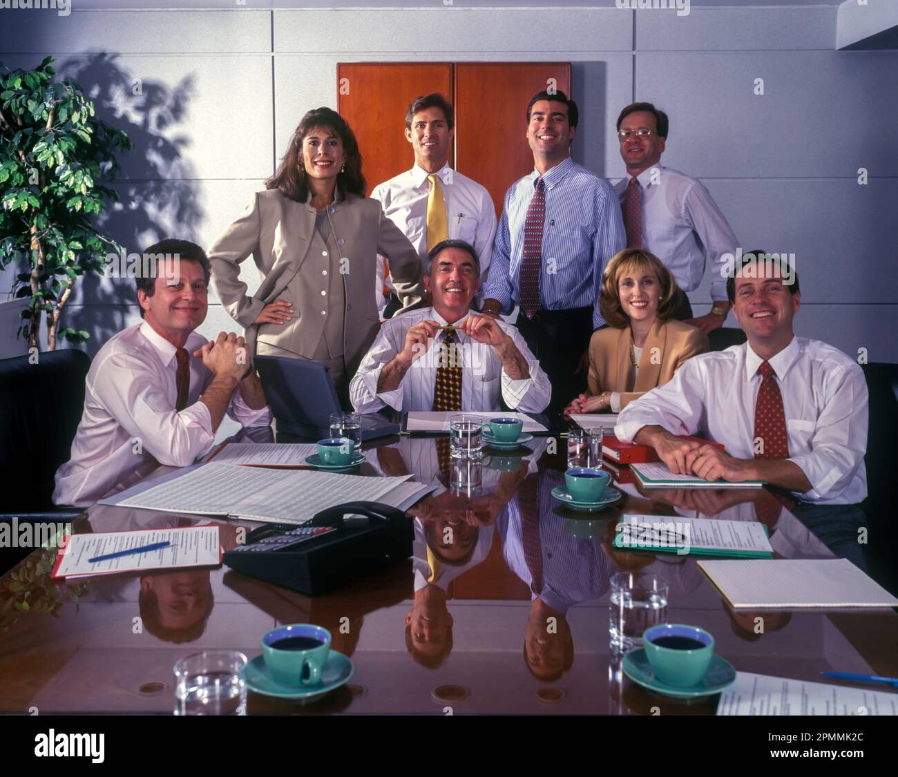 1994 HISTORICAL GROUP OF SMILING OFFICE WORKERS AROUND CONFERENCE ROOM ...