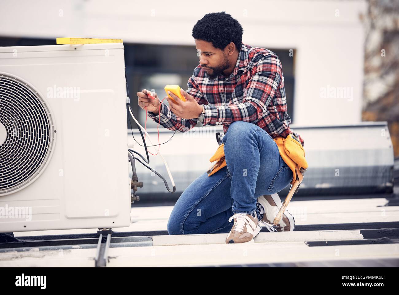 Air conditioner, roof and technician man repair, maintenance and ...