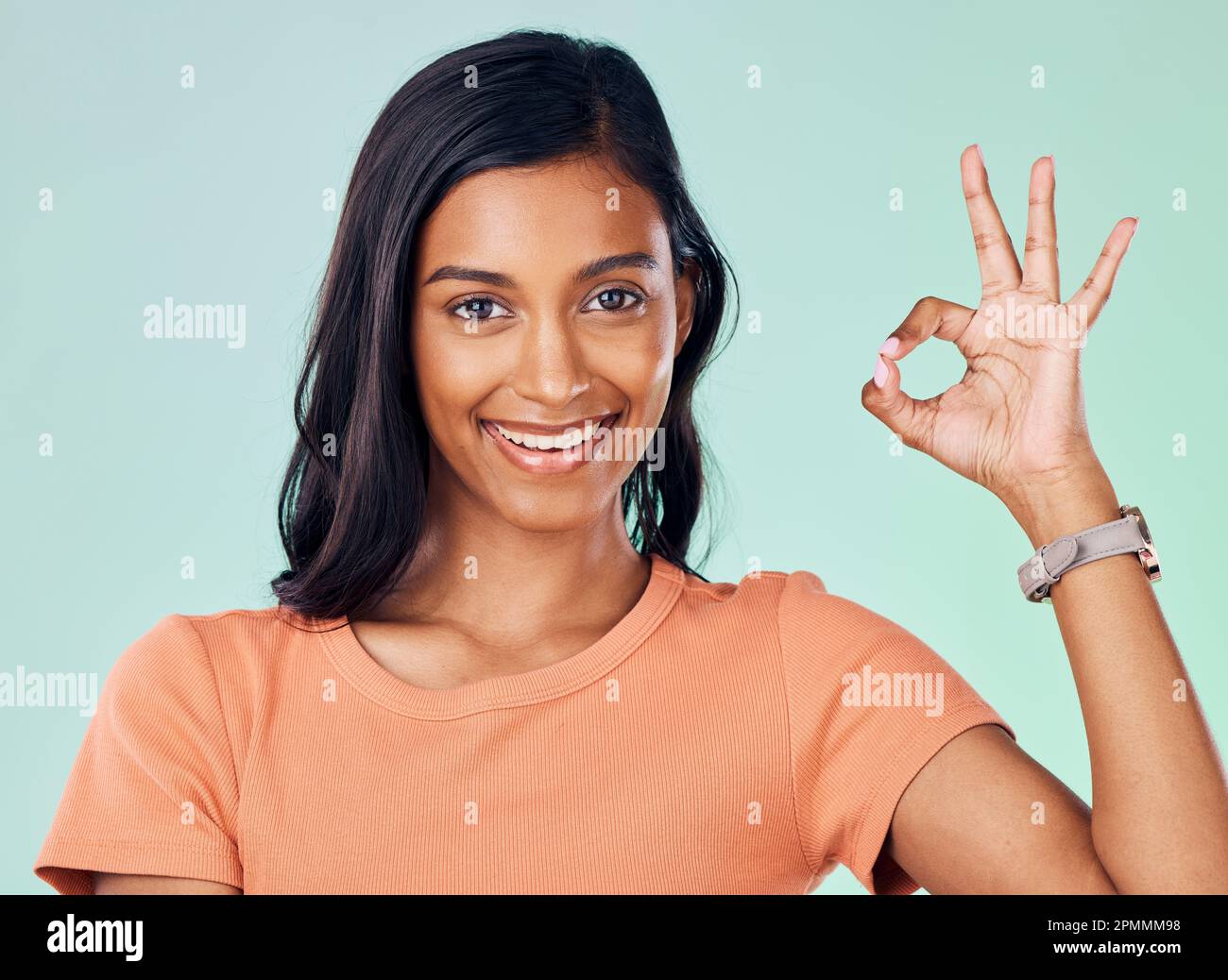 Portrait, perfect hand gesture and woman in a studio with a positive ...