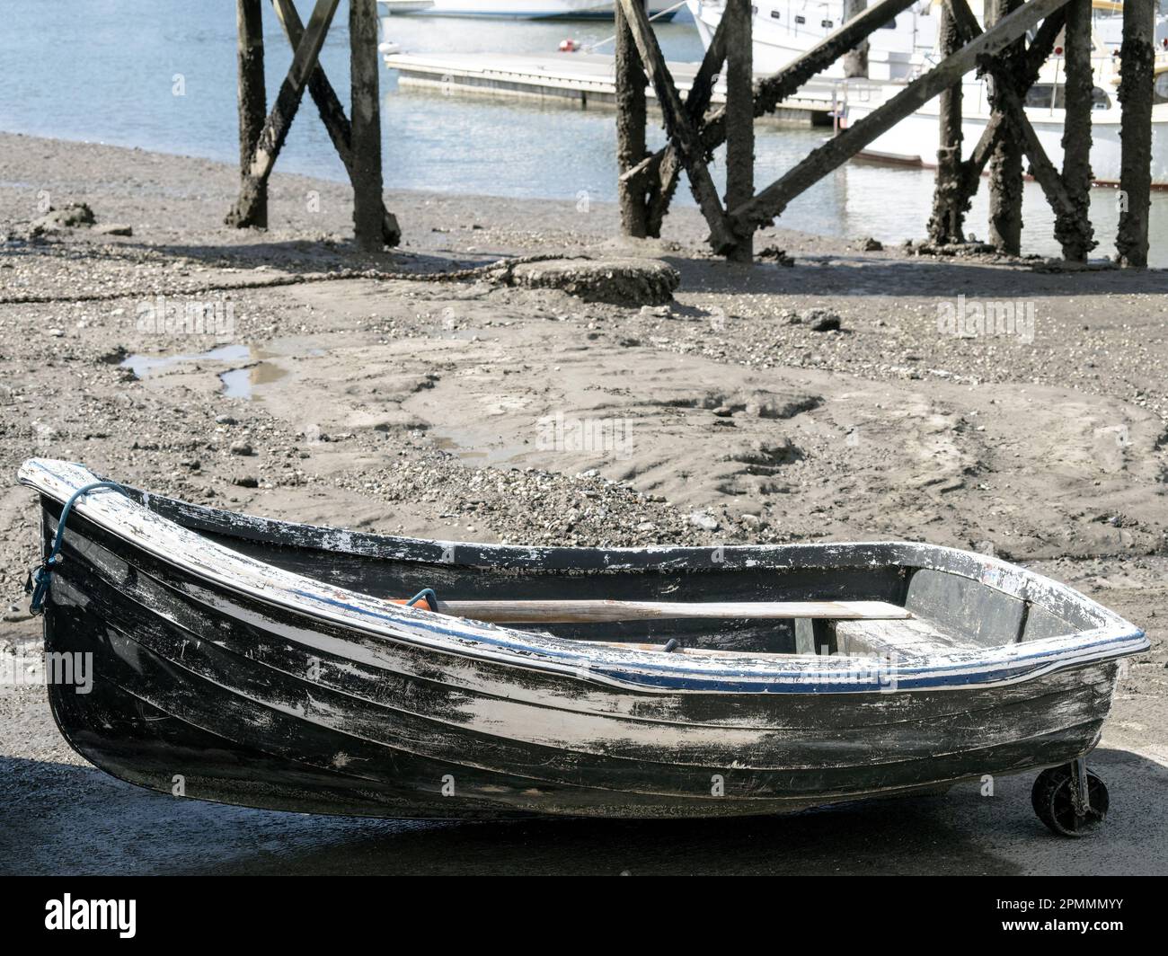 A small dinghy row tender boat on a sandy beach Stock Photo - Alamy