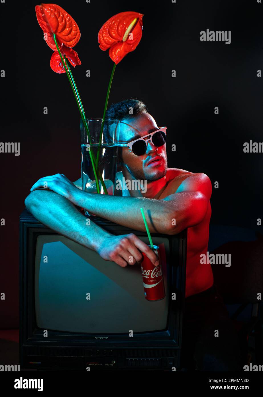 Portrait of a young man holding a can of Coca Cola Stock Photo - Alamy