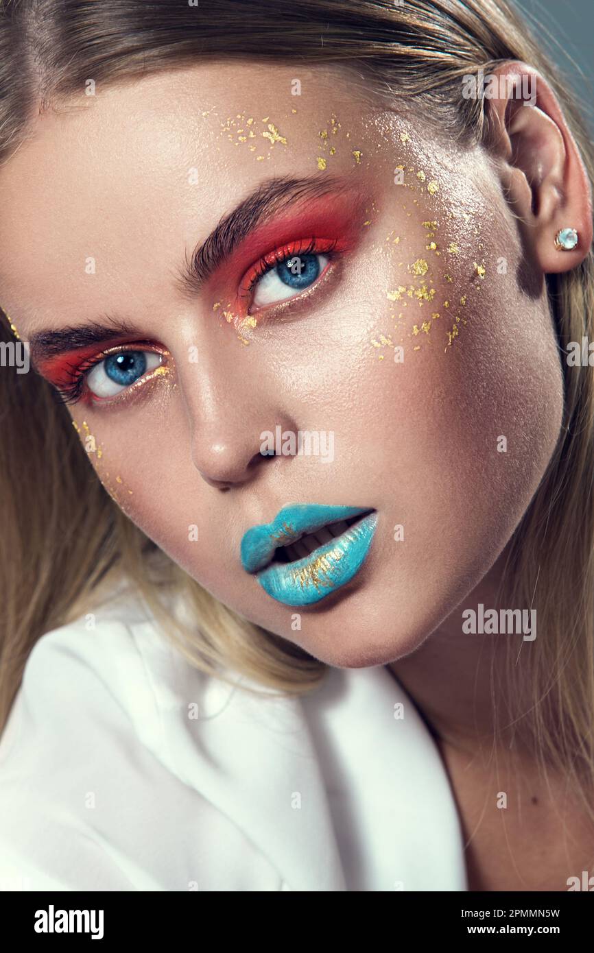 A girl with creative makeup poses in the studio Stock Photo - Alamy