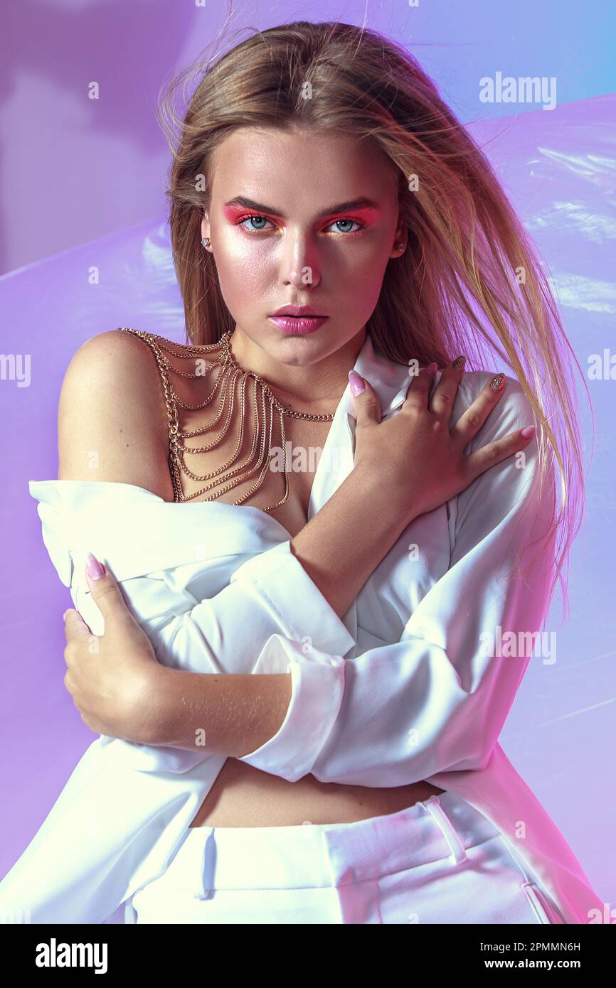A girl with creative makeup poses in the studio Stock Photo - Alamy