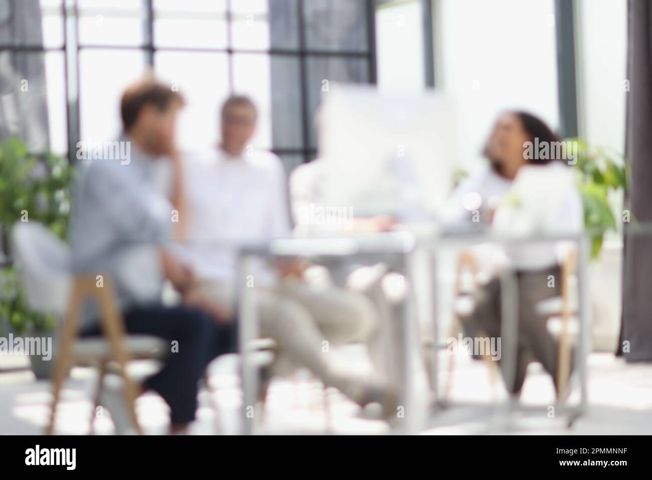 Conversation between managers and employees in the office. Blurred ...