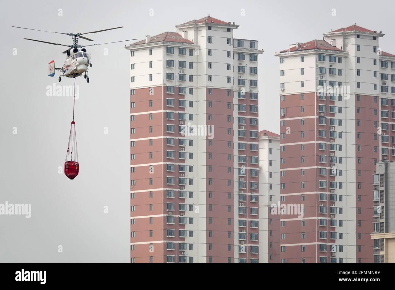 YANTAI, CHINA - APRIL 13, 2023 - A KA-32 helicopter loaded with fire ...